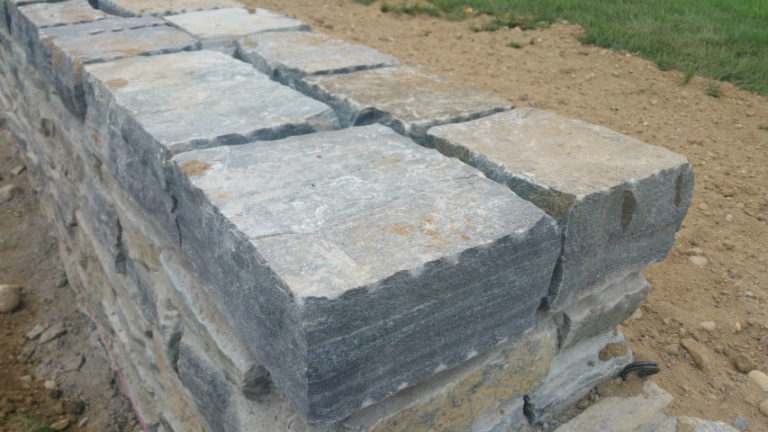 Hand chiseled granite retaining wall Long Island NY | Millenium Stoneworks